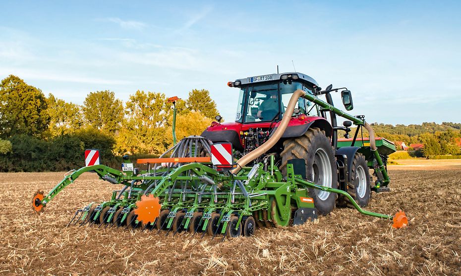 Avant mounted seed drill combination with FTender mounted front hopper